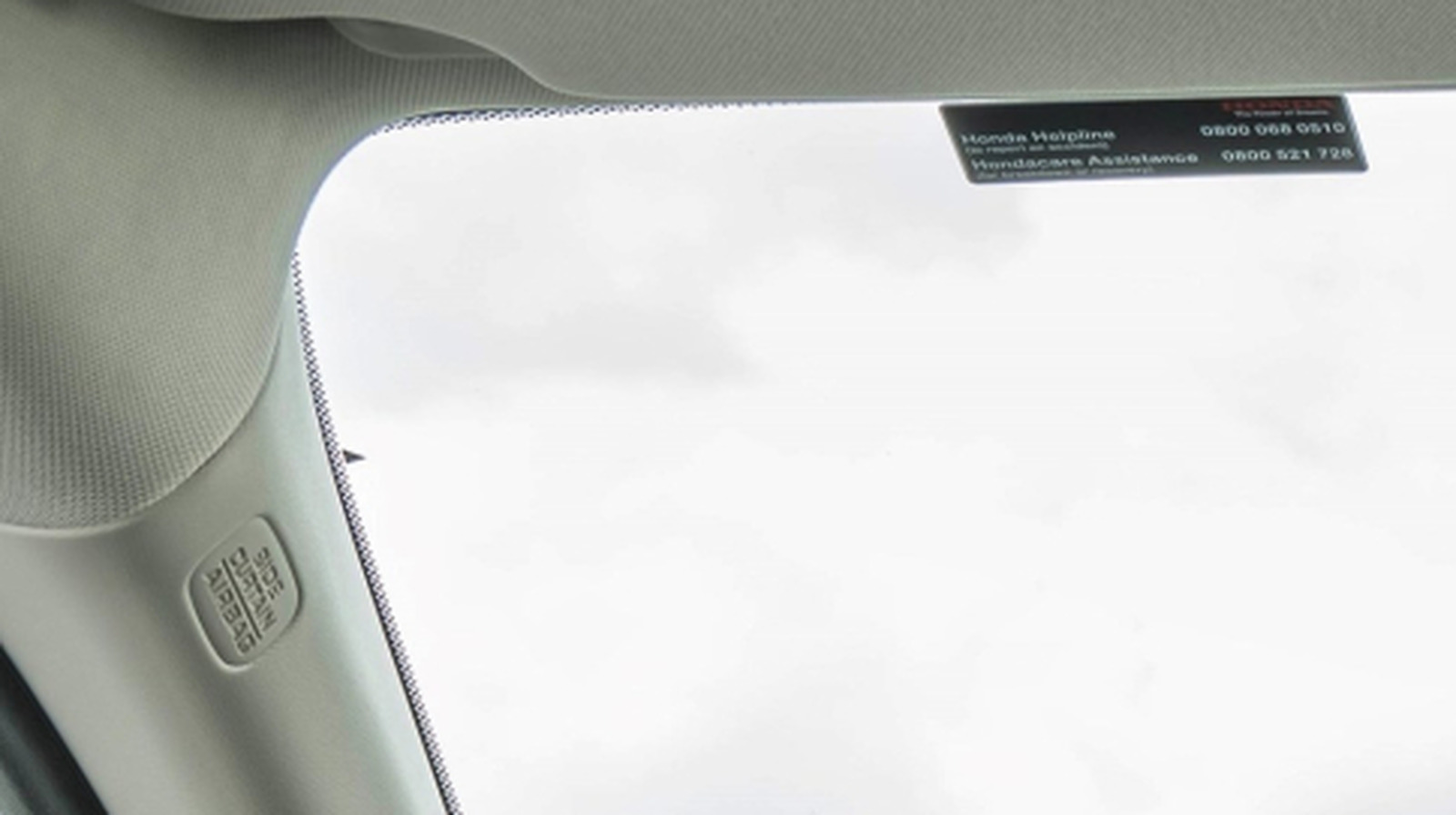 Here's What Those Little Triangles On Your Honda Windshield Are For