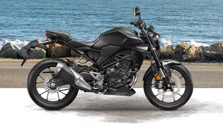 black Honda CB300R ABS parked next to ocean