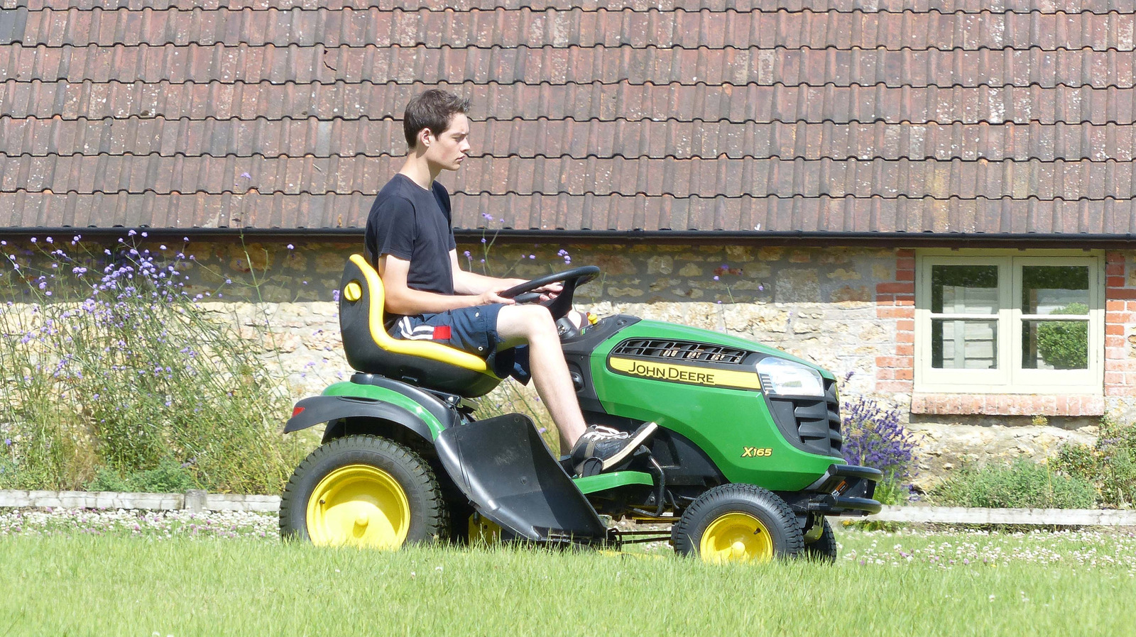 Riding Mower Vs. Lawn Tractor: Which Is Right For Your Yard?
