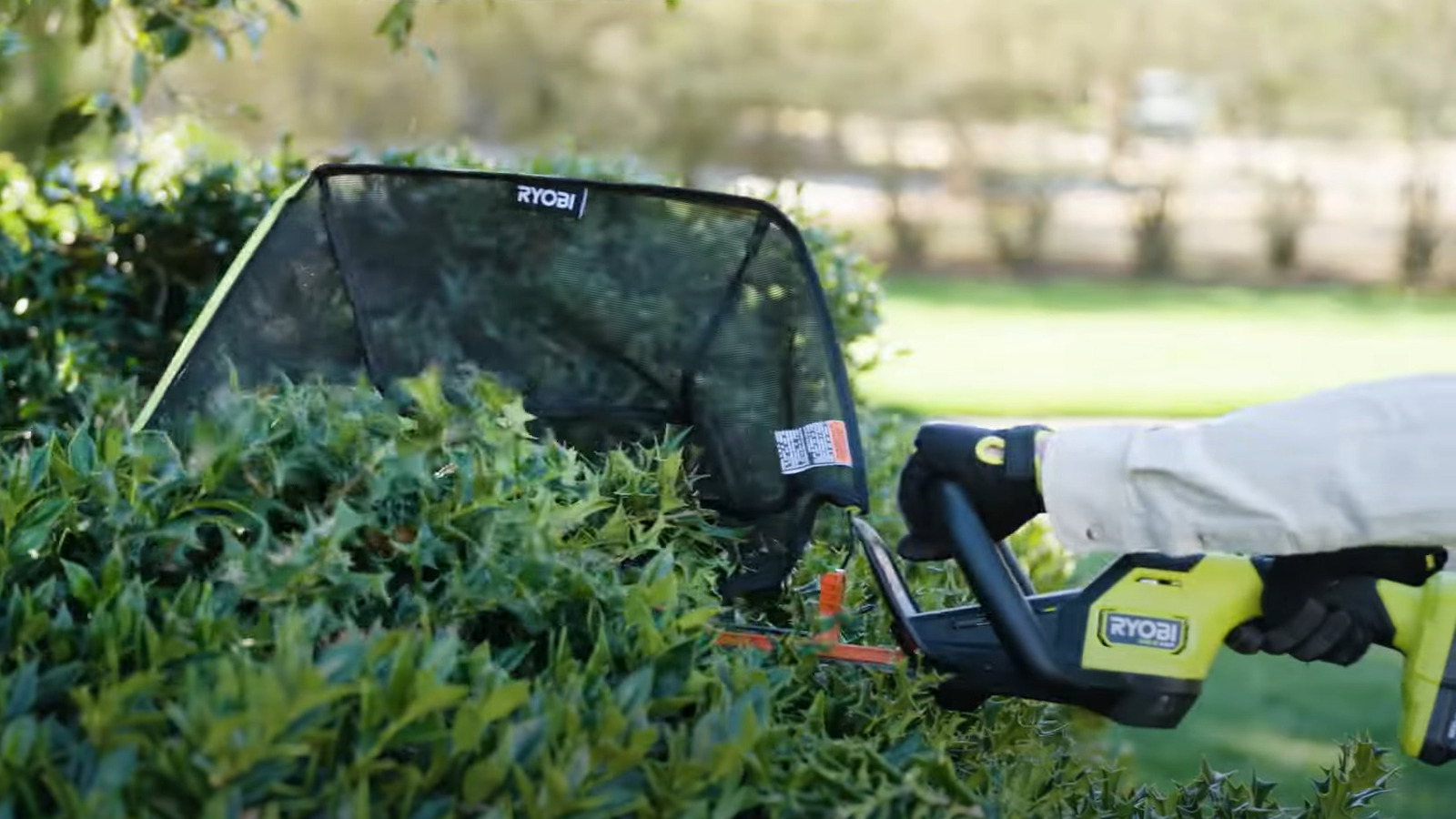 The Ryobi Hedge Trimmer Attachment That Cleans Up Debris While You Work