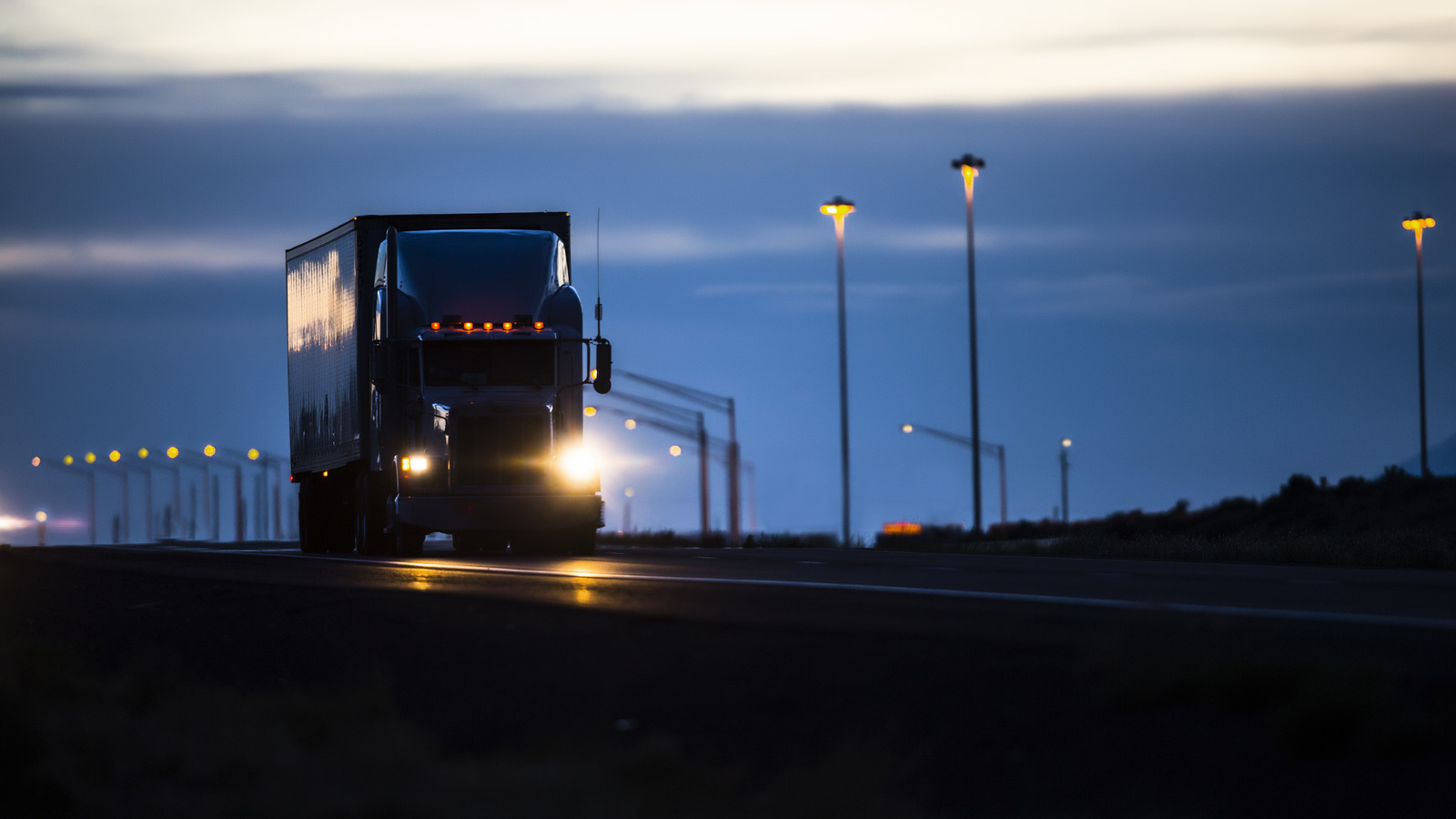 Why Do Semi-Trucks Flash Their Lights? Here's What It Means