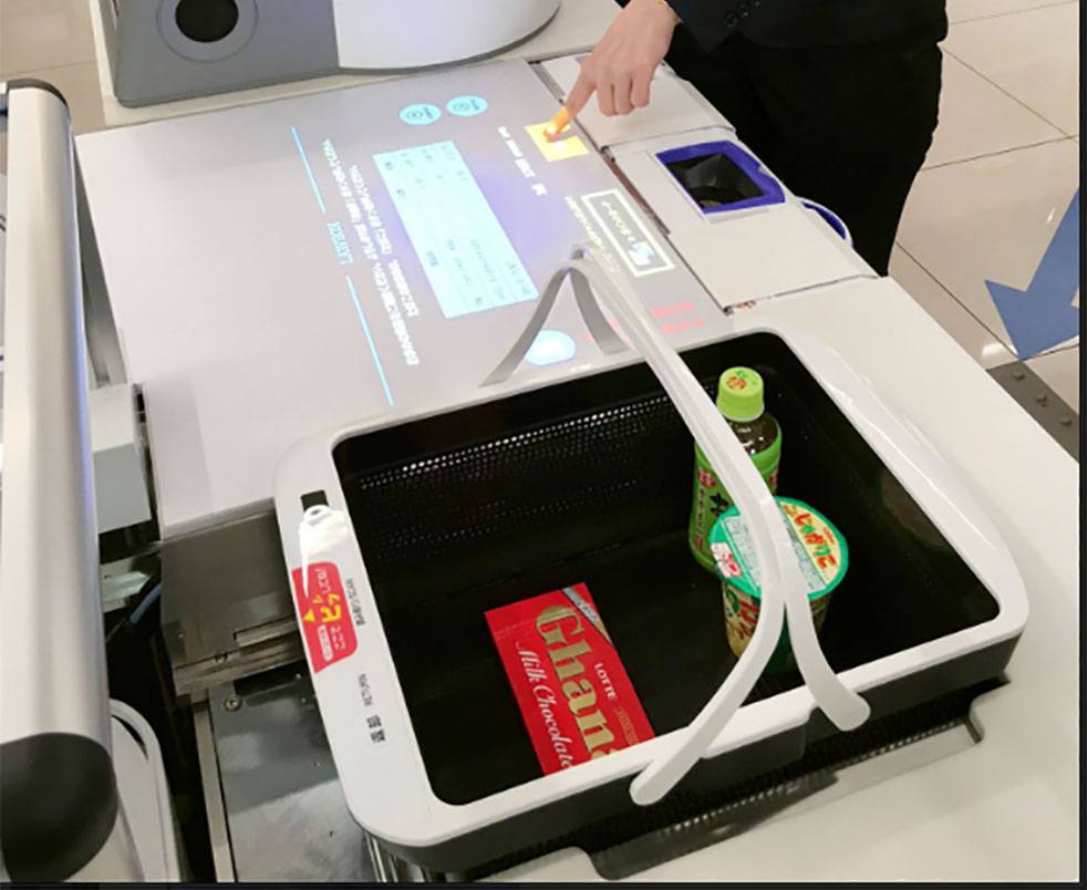 Robotic cashier rings up purchases and bags them in Osaka, Japan ...