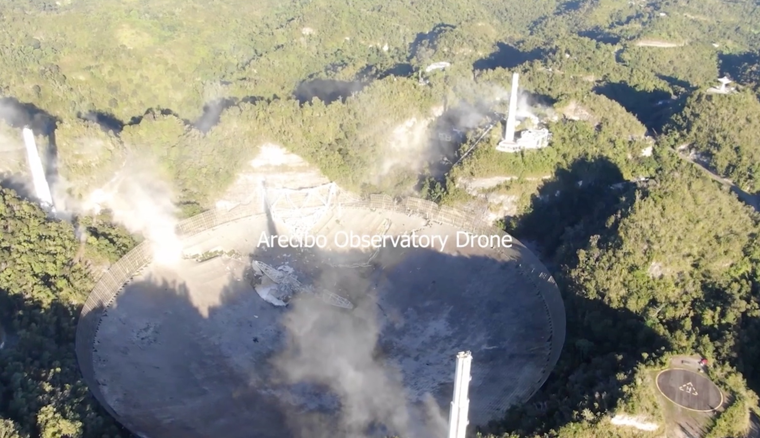 Watch the dramatic Arecibo Observatory collapse from a drone's eye view ...